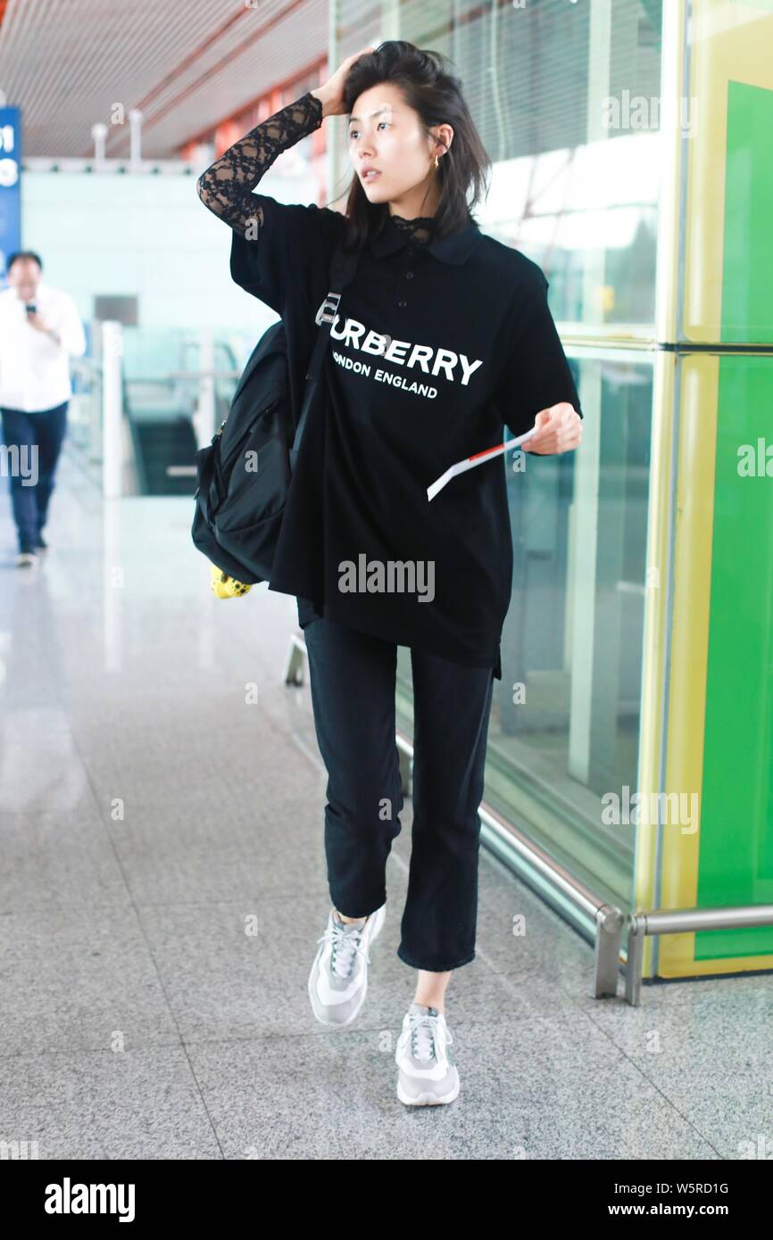 Chinese supermodel Liu Wen arrives at the Beijing Capital International ...