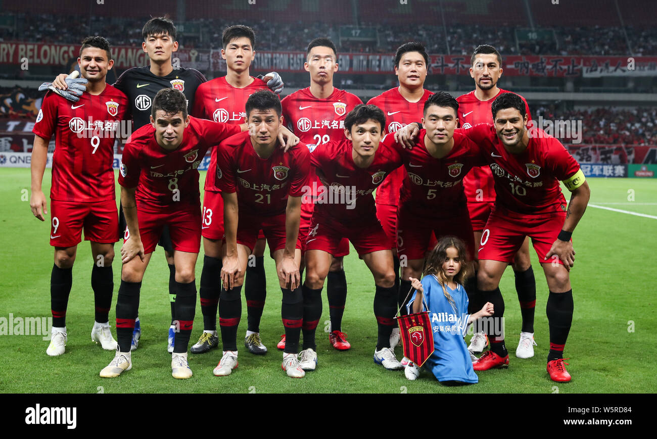 Players of the starting line-up of China's Shanghai SIPG F.C. pose for ...