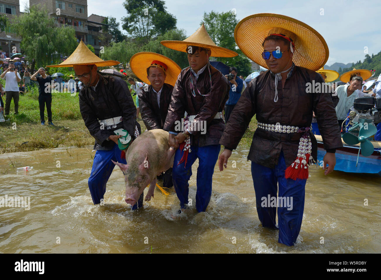 Chinese people of Miao ethnic minority take part in a dragon race ...