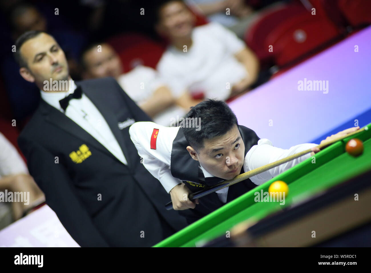 Ding Junhui of China A plays a shot to Norway in the Group A match ...