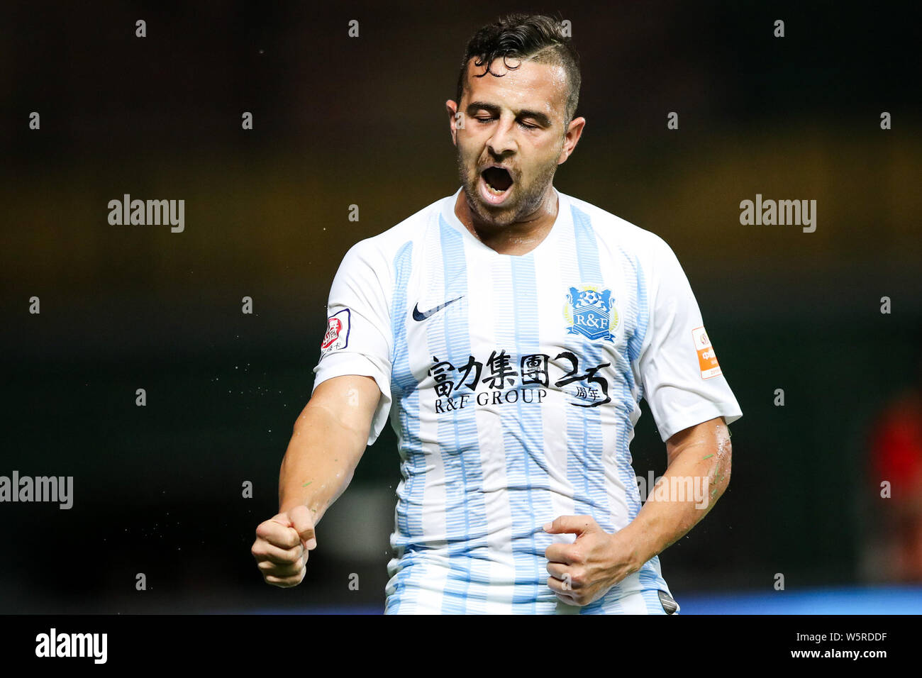 Israeli-Arab football player Dia Saba of Guangzhou R&F celebrates after ...