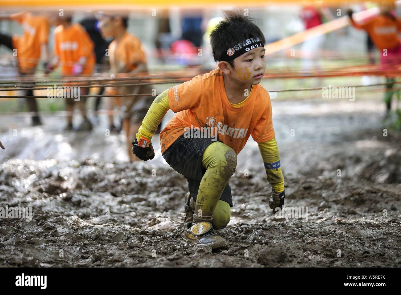 Kids compete in the Spartan kids' race to mark the International ...