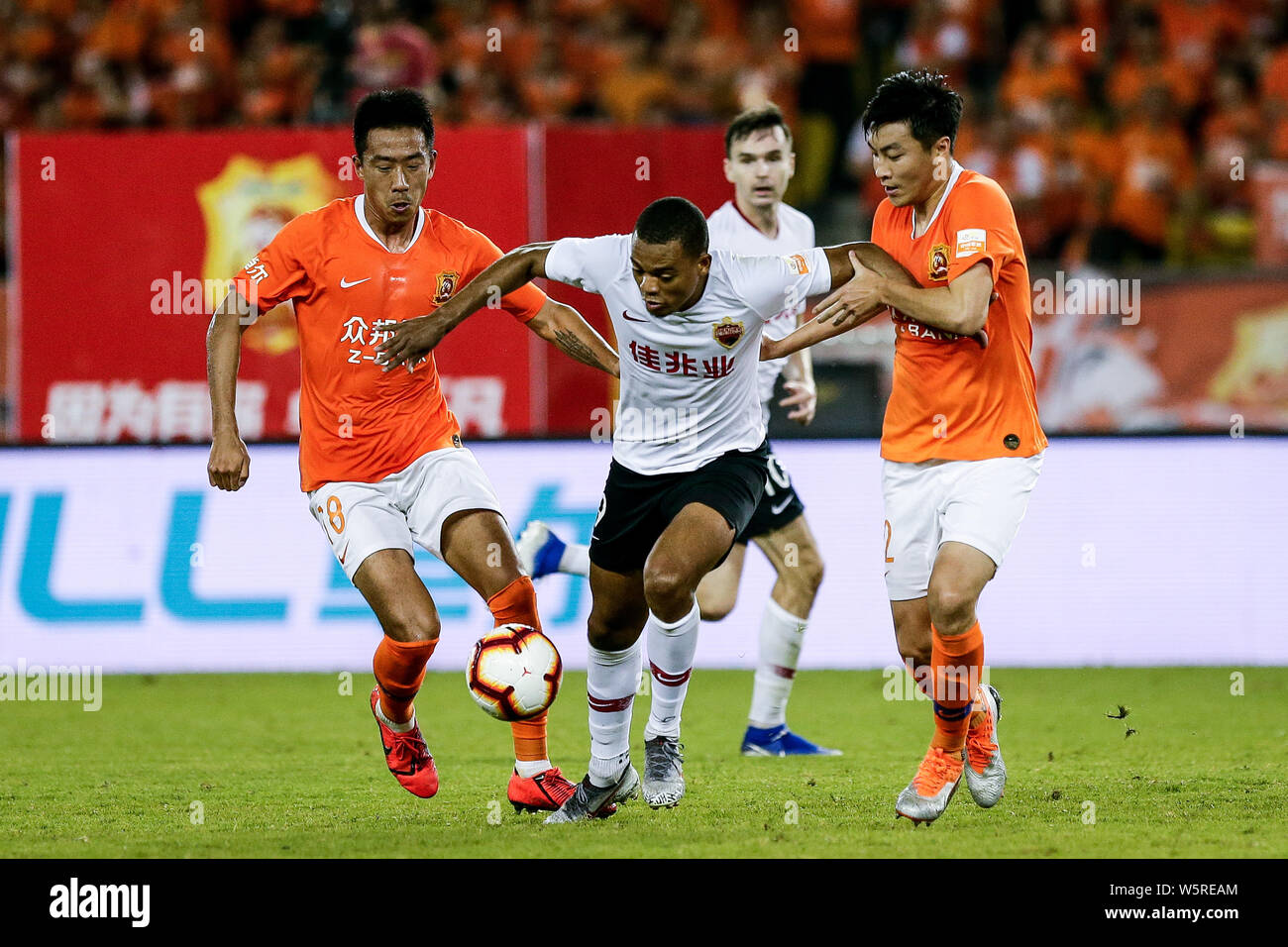 Colombian football player Harold Preciado, center, of Shenzhen F.C ...