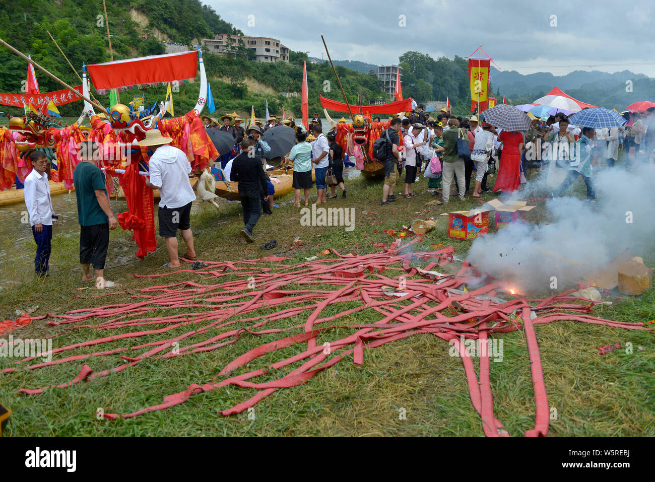 Chinese people of Miao ethnic minority take part in a dragon race ...