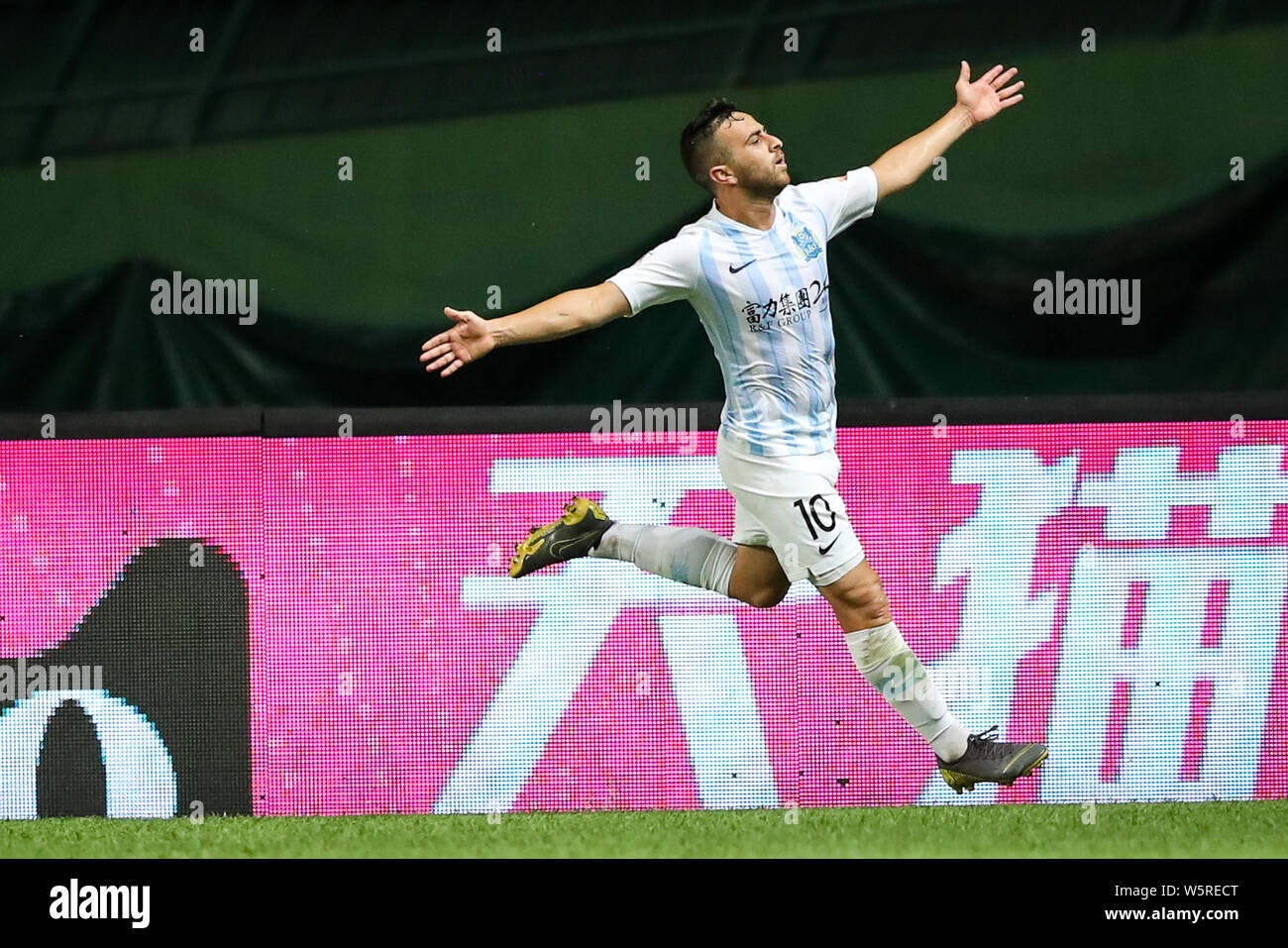 Israeli-Arab football player Dia Saba of Guangzhou R&F celebrates after ...