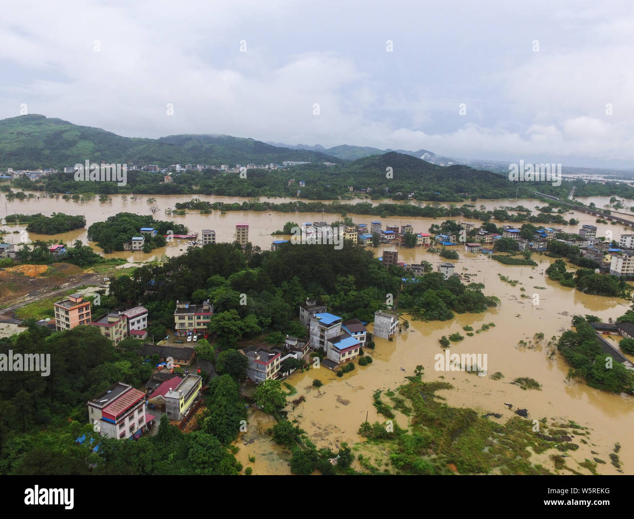 An aerial view of the flooded roads and fields near the Quanzhou South ...