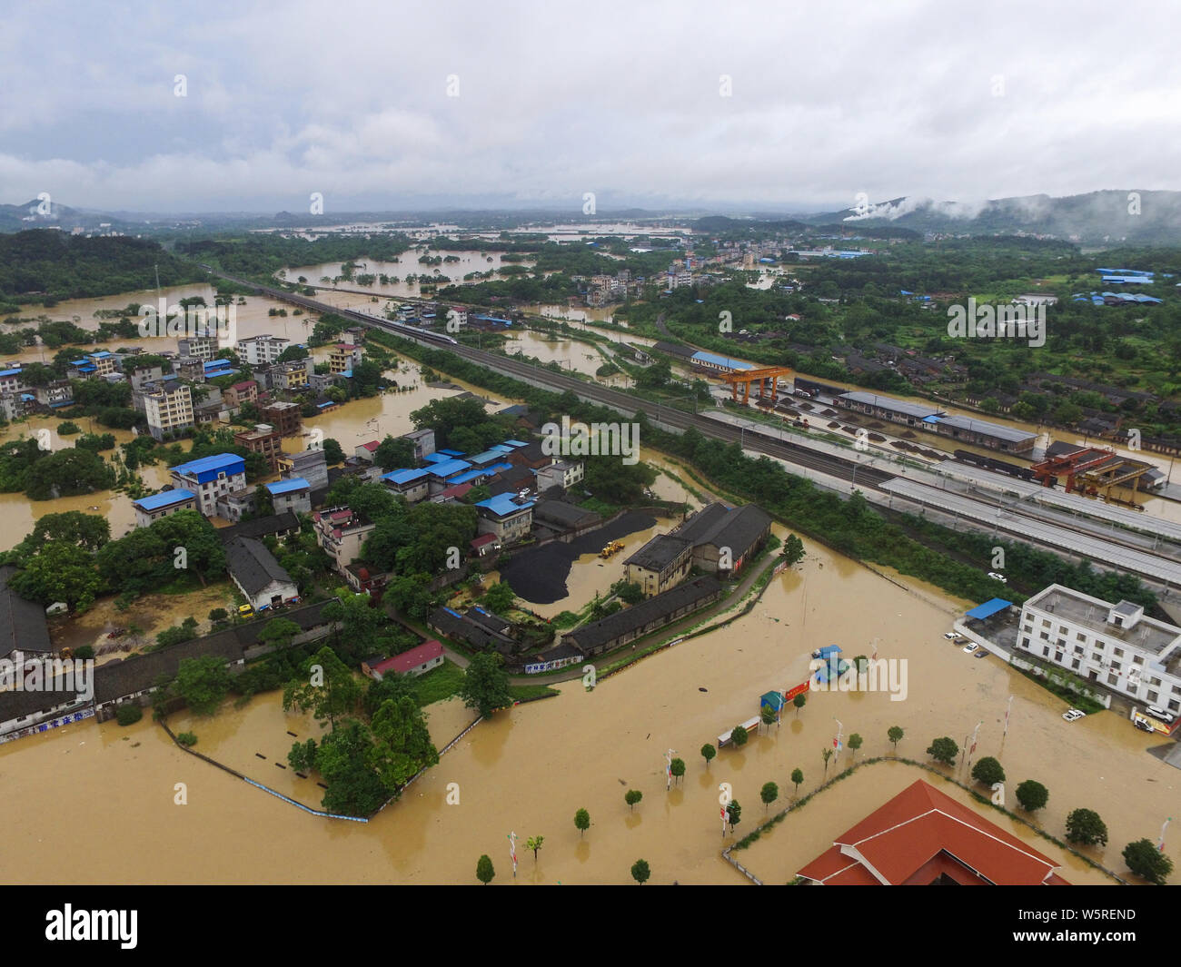 An aerial view of the flooded roads and fields near the Quanzhou South ...