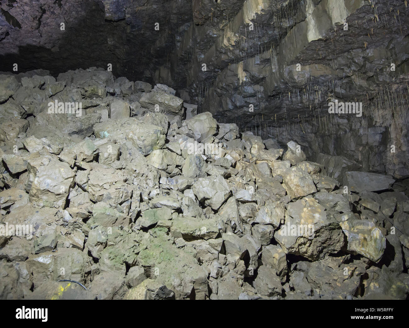 Inside interior of a large underground cave cavern with calcite ...