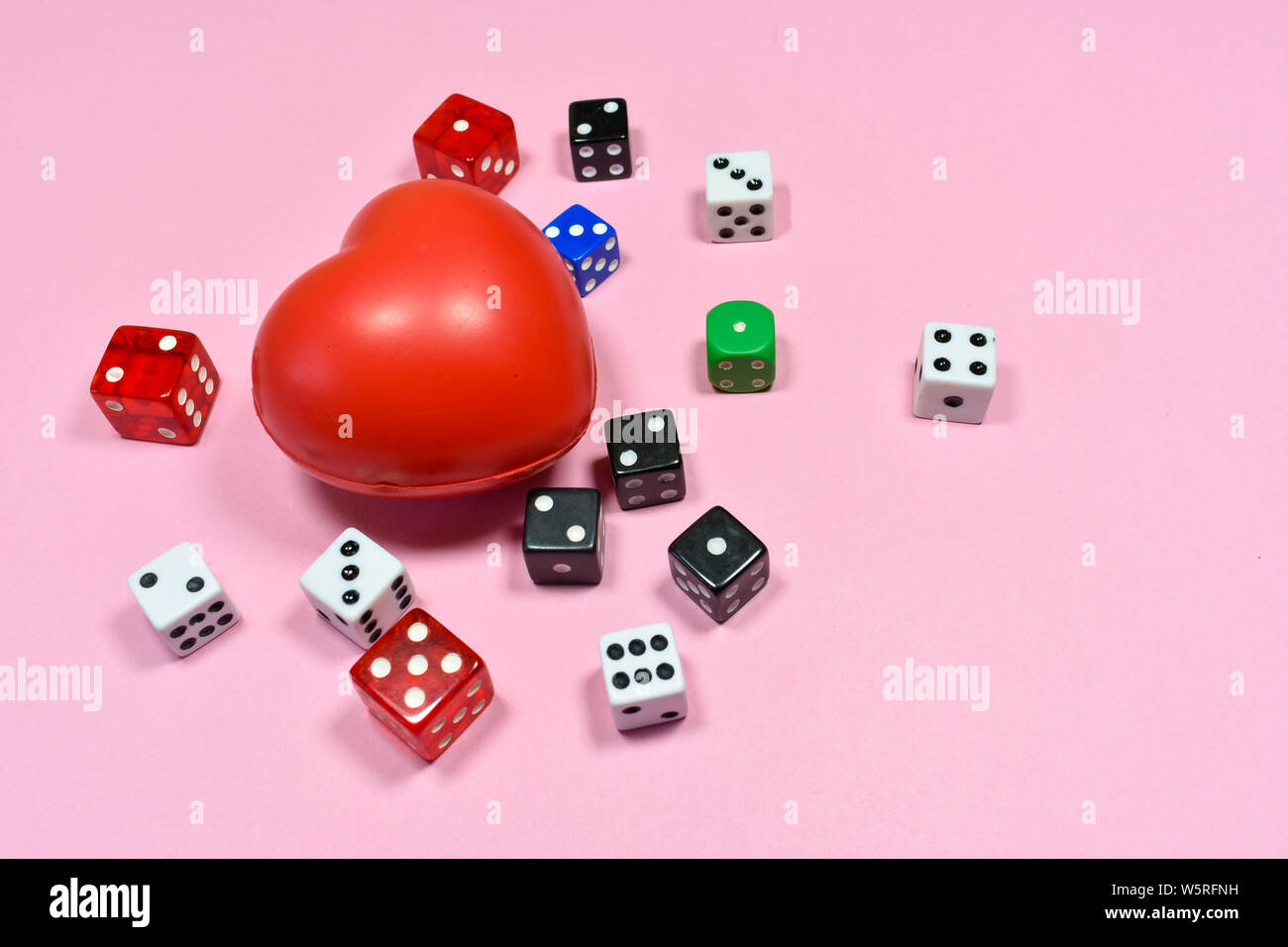 Human shaped red spongy heart on pink background , with many colored ...