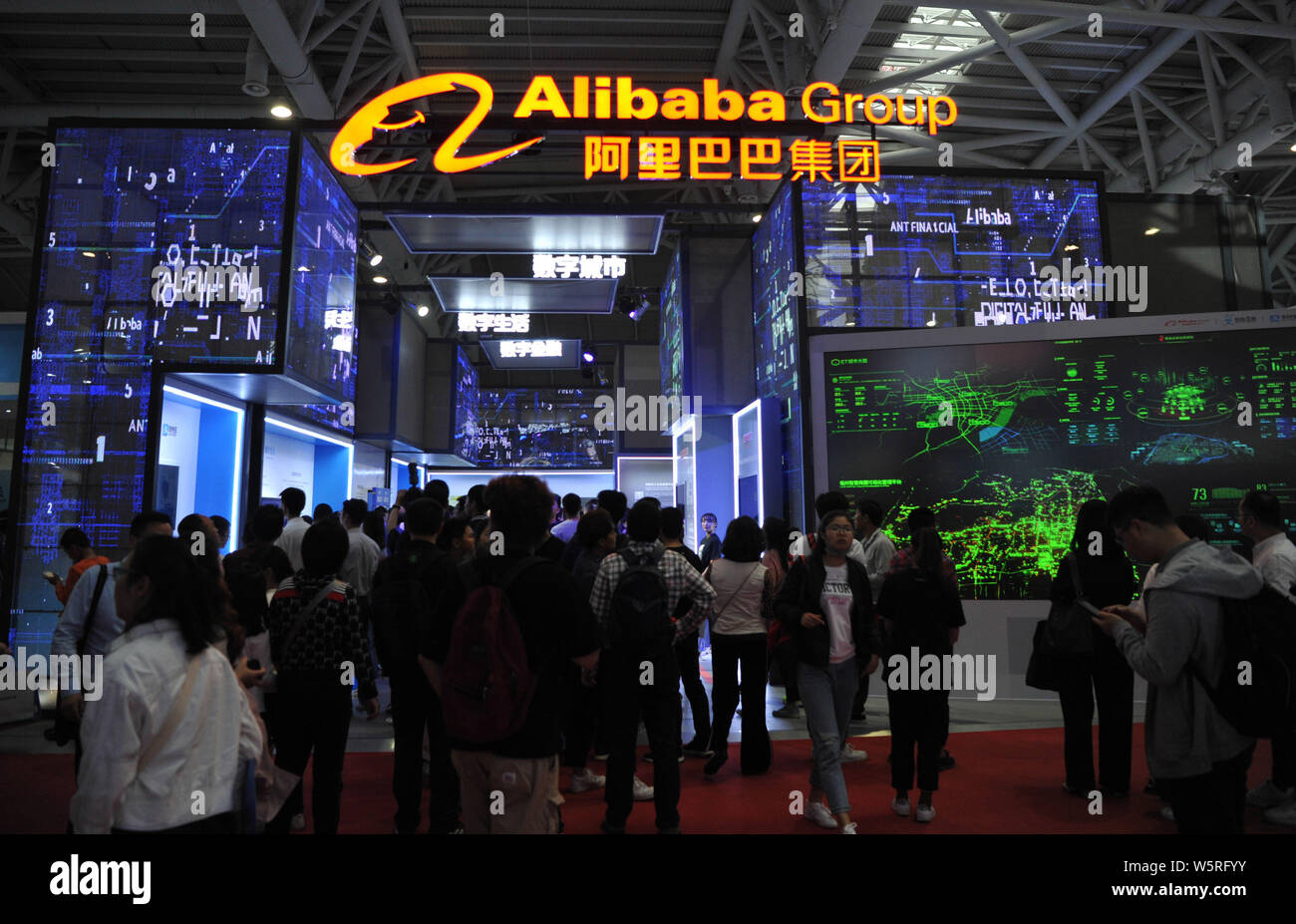 --FILE--People visit the stand of Alibaba Group during an expo in ...