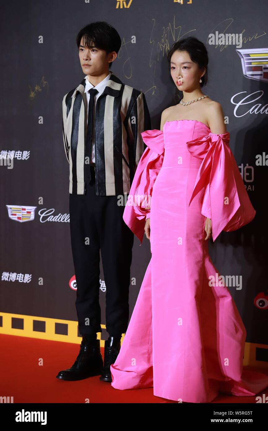 Jackson Yee or Yi Yangqianxi of Chinese boy group TFBoys, left, and ...