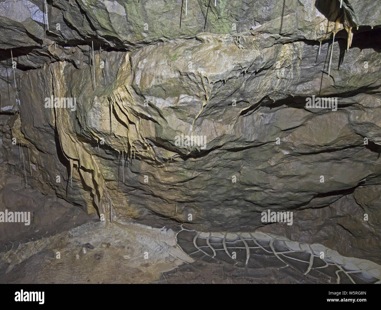 Inside interior of a large underground cave cavern with calcite ...