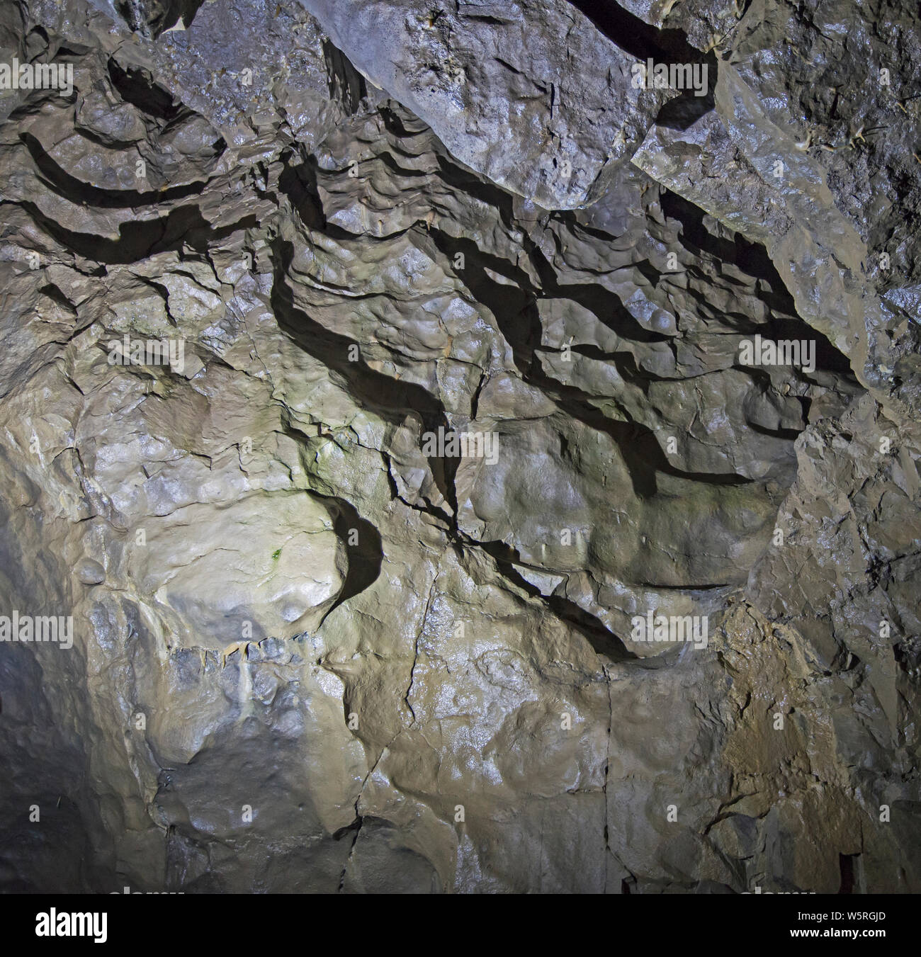 Inside interior of a large underground cave cavern with calcite ...