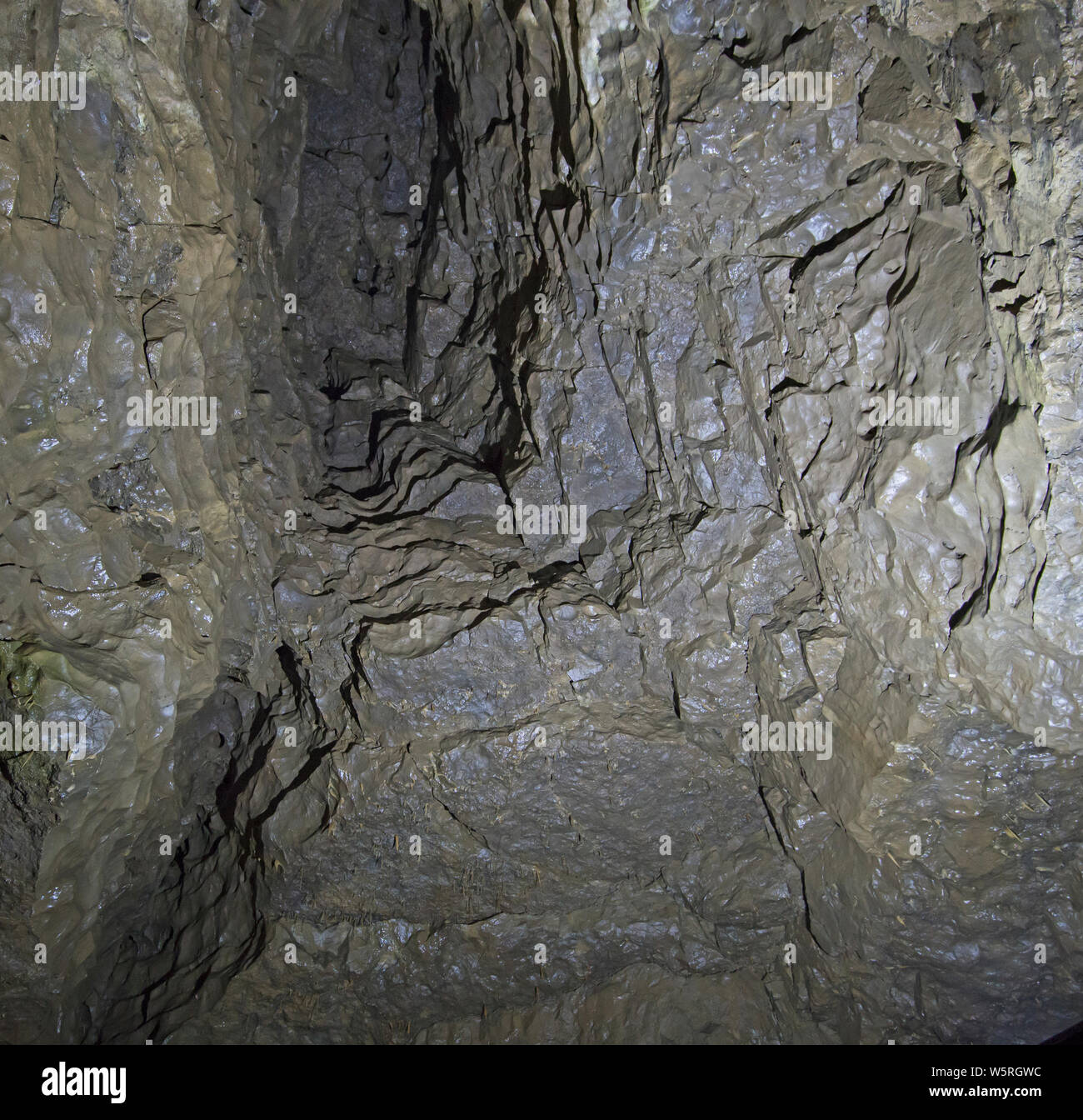 Inside interior of a large underground cave cavern with calcite ...