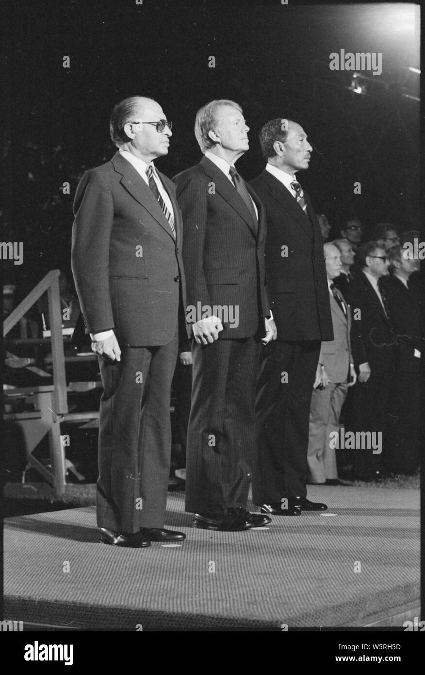 Menahem Begin, Jimmy Carter and Anwar Sadat attend a military ...