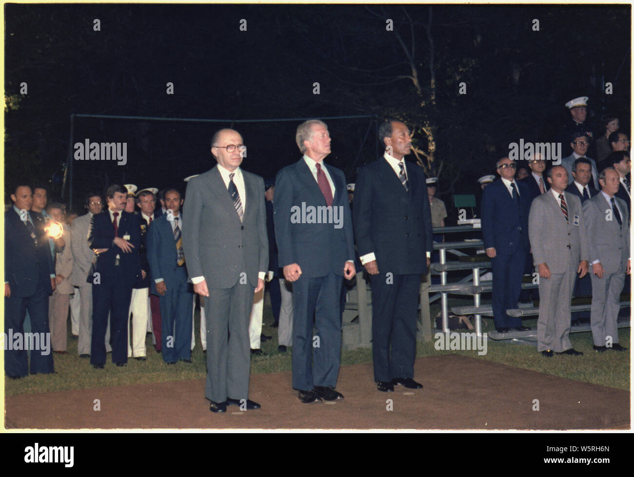 Menachem Begin, Jimmy Carter and Anwar Sadat attend a military ...