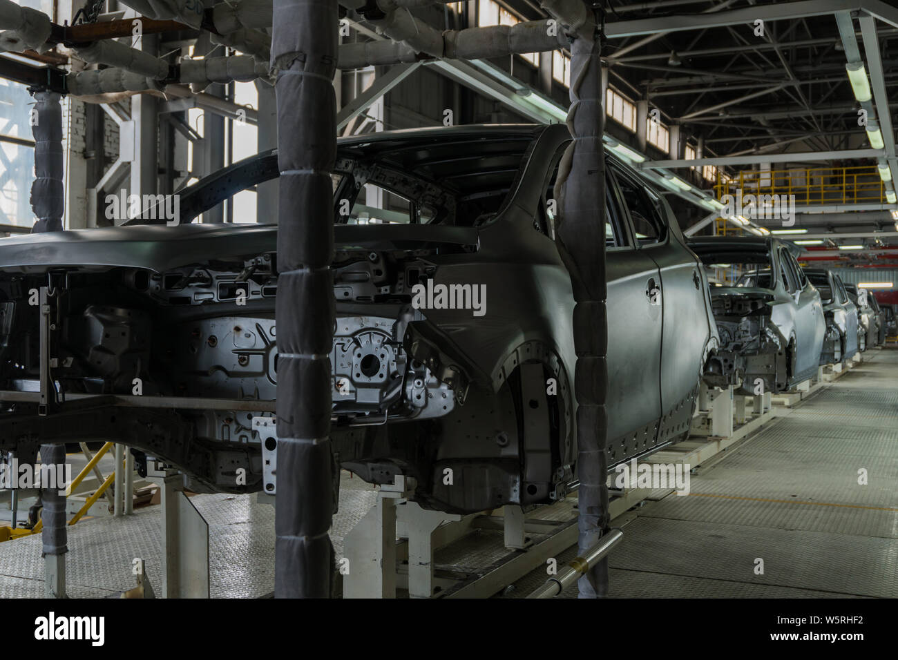 Car body on the production line. Car production. Modern technologies at ...