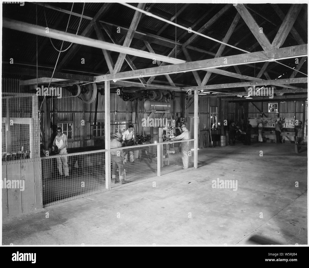 Mission shop, Viejas. [Interior view showing men at equipment.] Stock ...