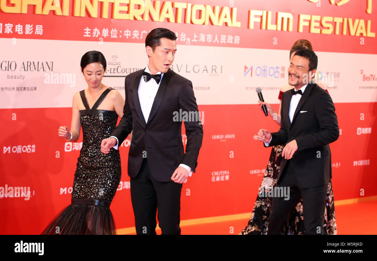 Chinese actors Hu Ge, left, and Liao Fan arrive on the red carpet for ...