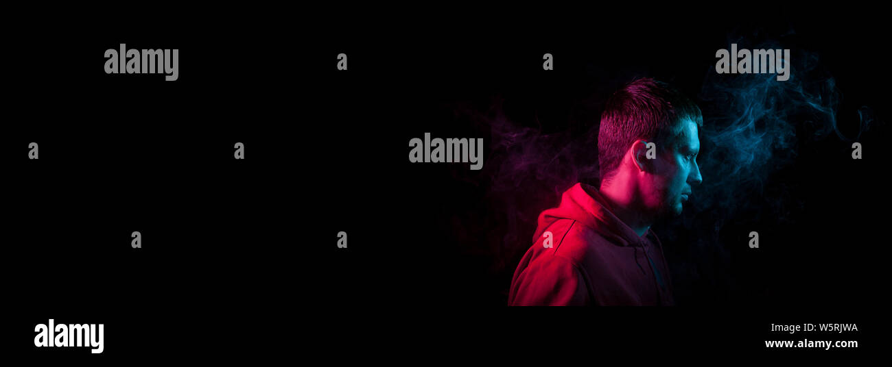 Banner with a portrait of a guy in profile face standing back to black ...