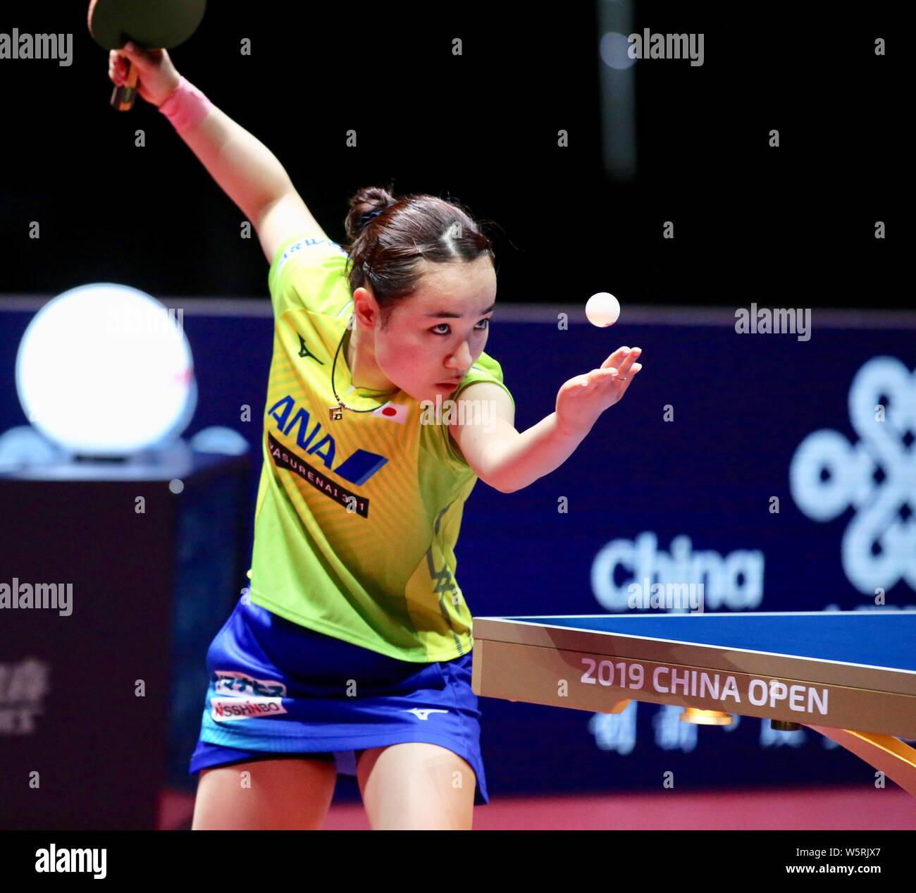 Ito Mima of Japan serves against Wang Manyu of China in the semifinal ...