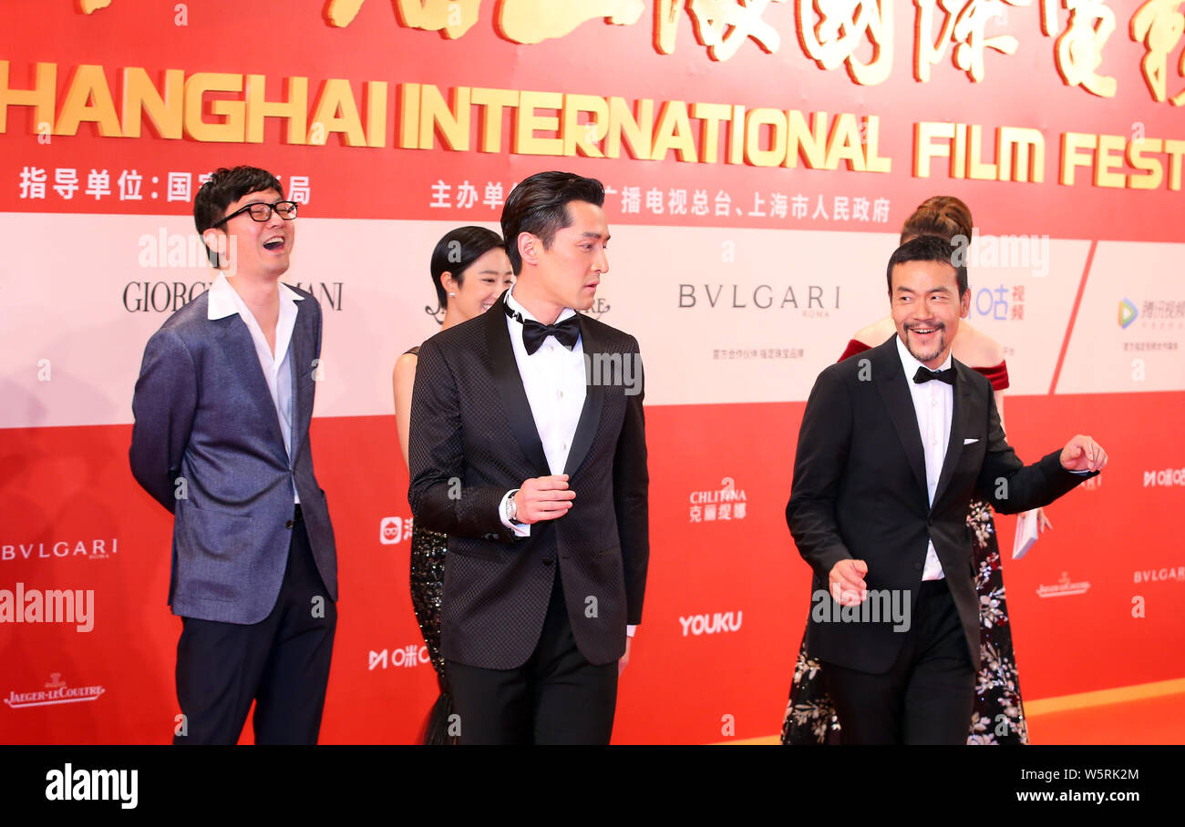 Chinese actors Hu Ge, left, and Liao Fan arrive on the red carpet for ...