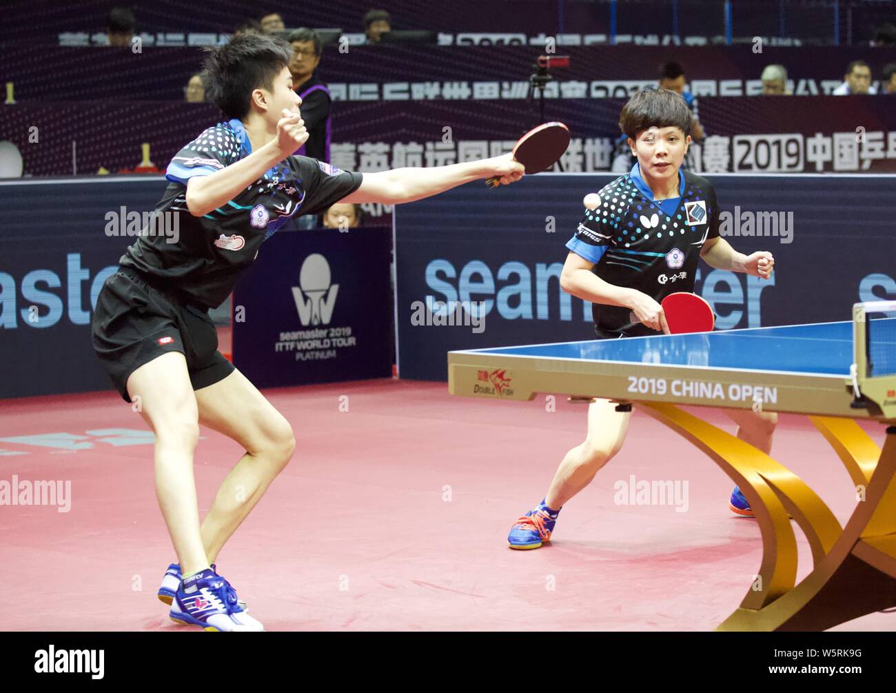 Lin Yen-jui and Cheng I-ching of Chinese Taipei return a shot to Xu Xin and Chen Meng of China ...