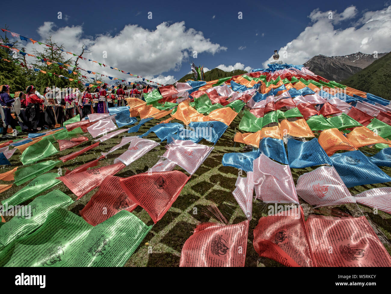 Local Tibetans sing and dance to celebrate the Siguniang worshipping ...
