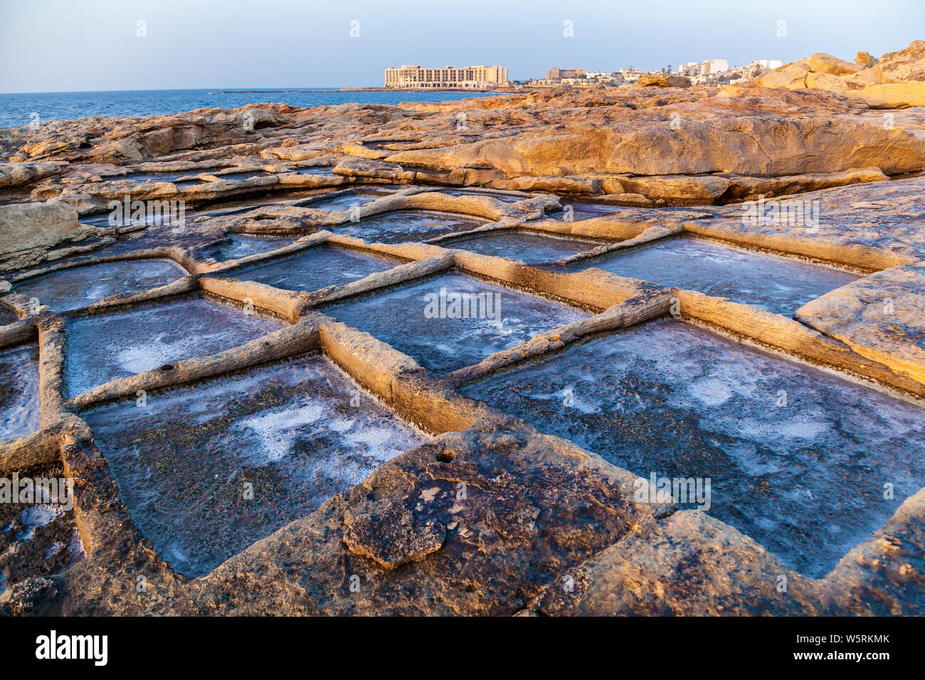 Extraction of sea salt from the evaporation of seawater in stone pools ...