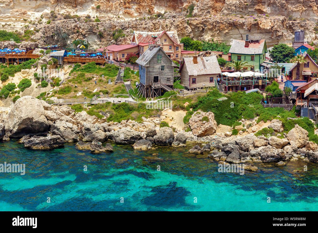 View of the famous village of Popeye with colorful wooden houses and ...