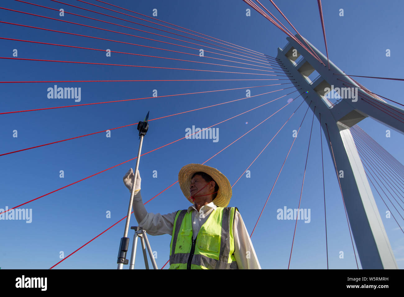 Chinese workers labor at the construction site of the Poyang Lake No. 2 ...
