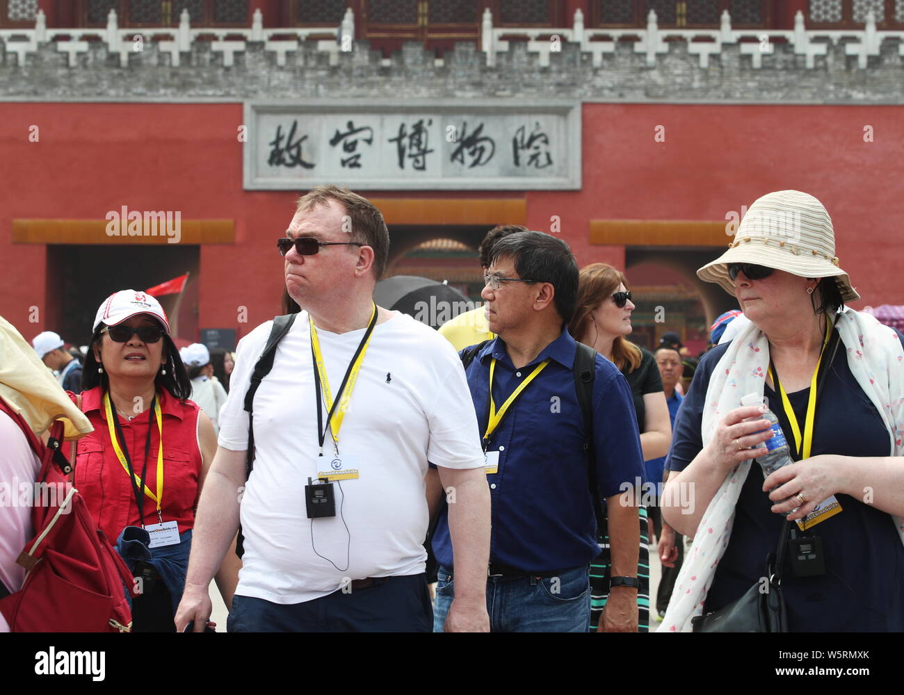 Tourists visit the Palace Museum, also known as the Forbidden City ...