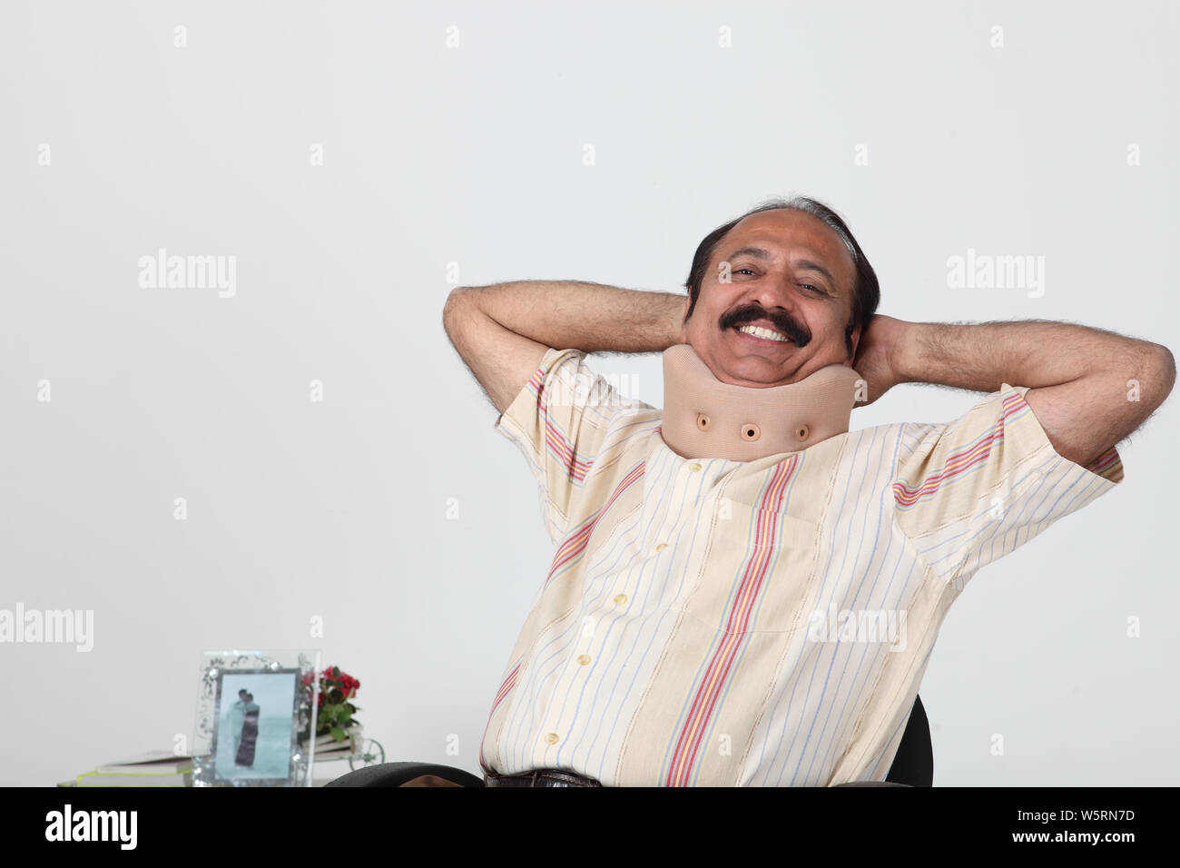 Old man neck brace hi-res stock photography and images - Alamy
