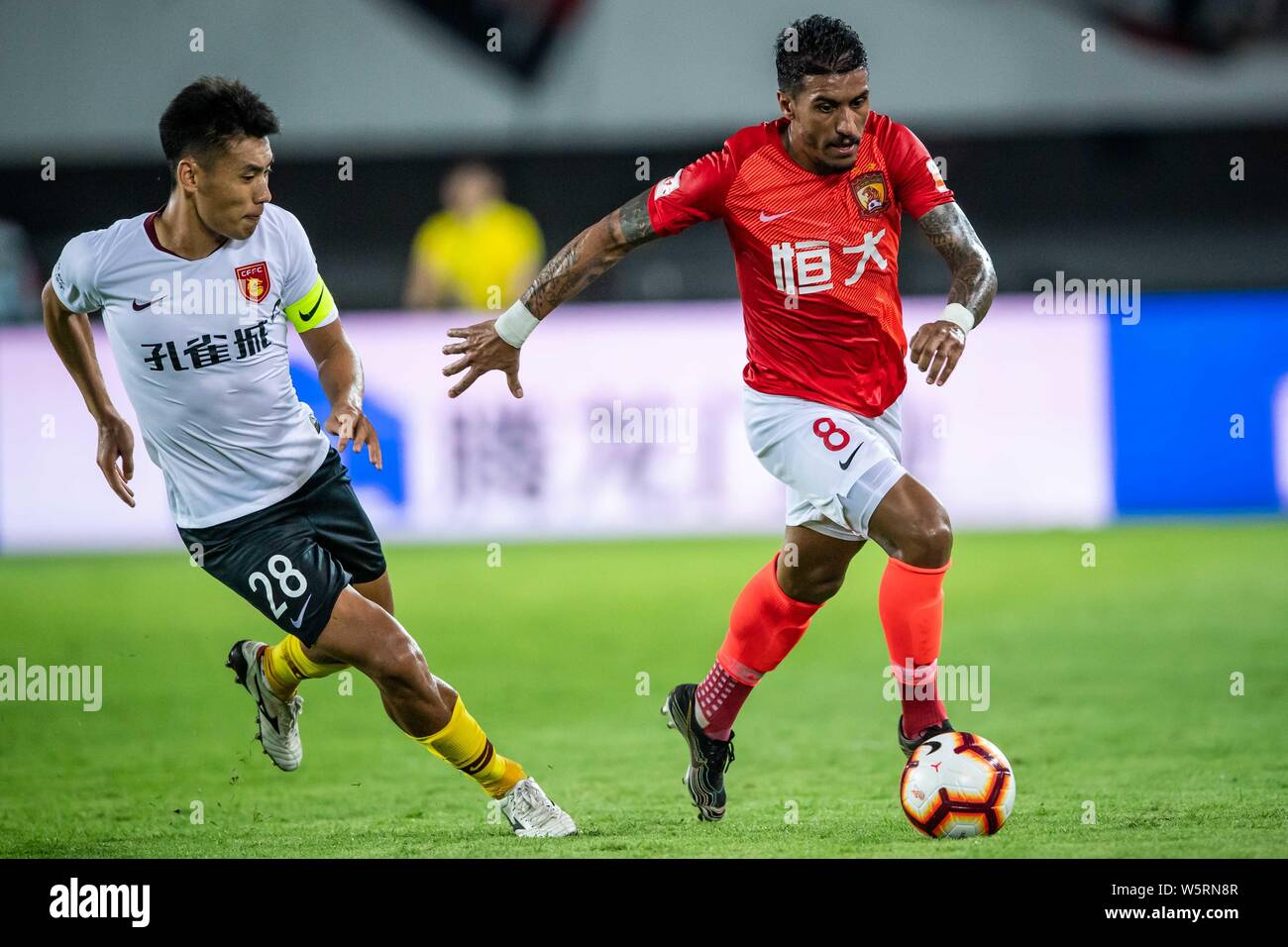 Brazilian football player Paulinho, right, of Guangzhou Evergrande ...
