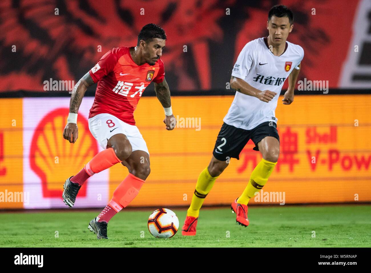 Brazilian football player Paulinho, left, of Guangzhou Evergrande ...