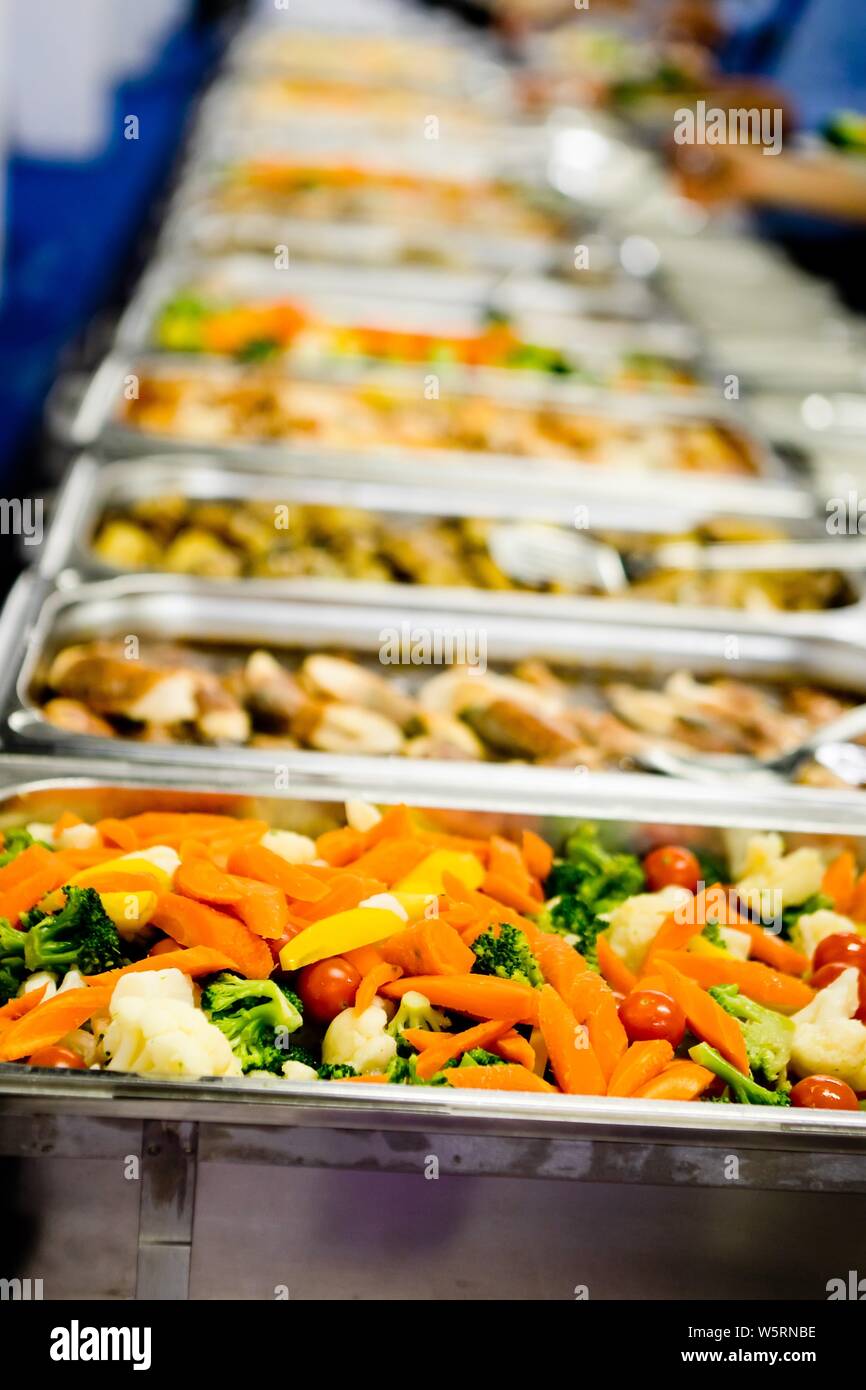 Steamed vegetables in professional warm catering, diversity of food ...