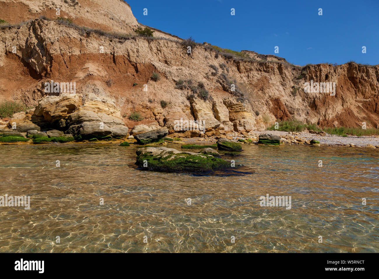 Yellow sandy rocks and stones of various forms on the Black Sea coast ...