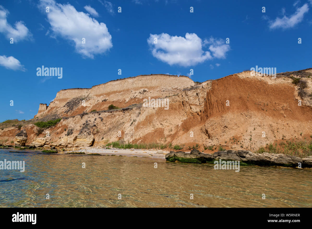 Yellow sandy rocks and stones of various forms on the Black Sea coast ...