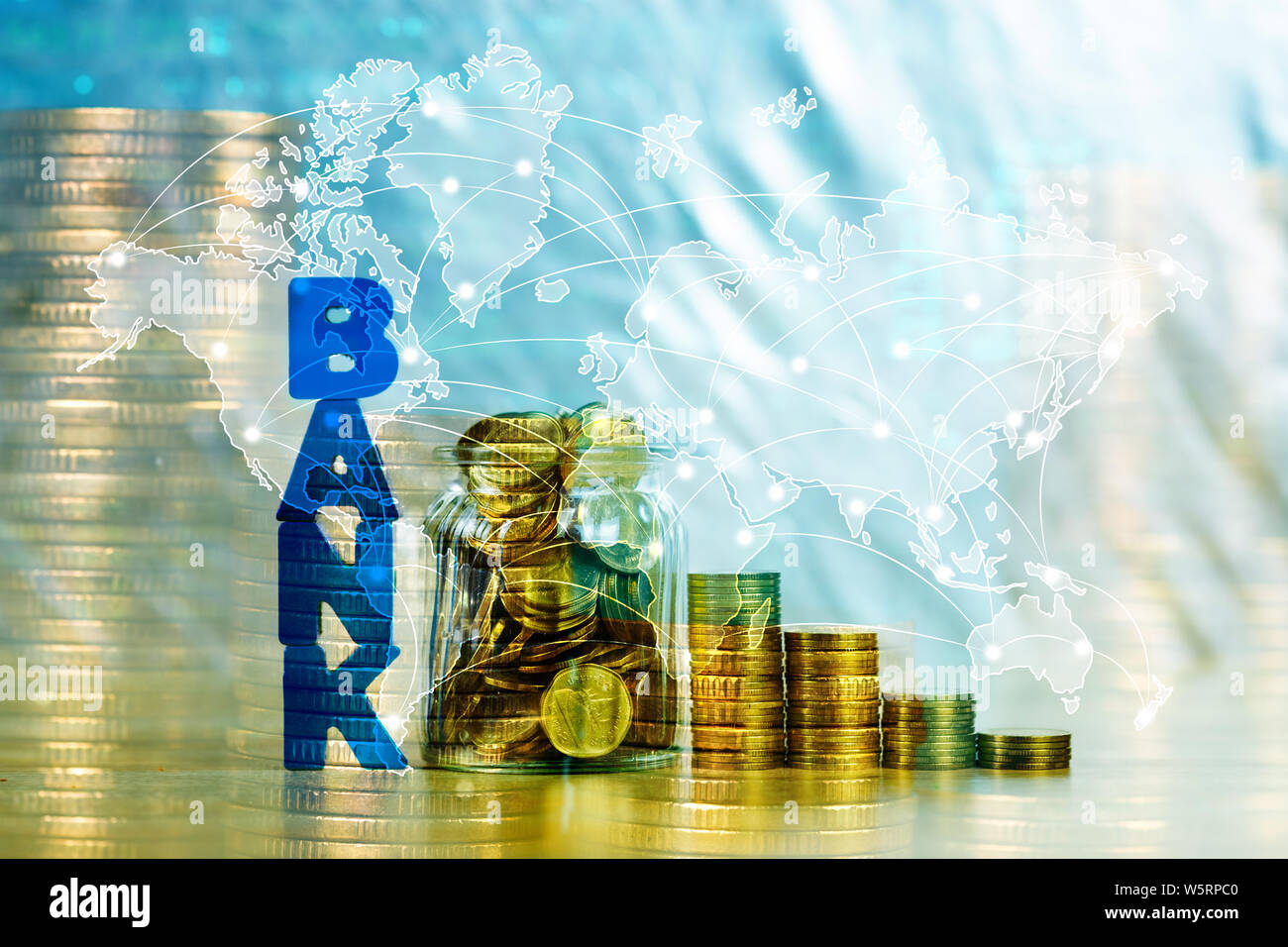 BANK text with Coin money in the glass jar on table, for saving and ...