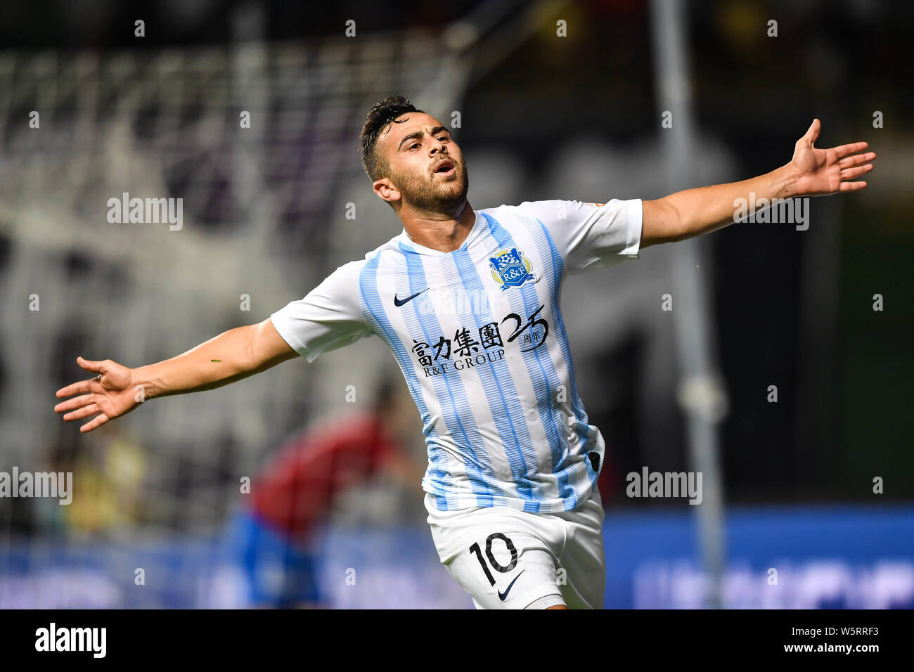 Israeli-Arab football player Dia Saba of Guangzhou R&F celebrates after ...