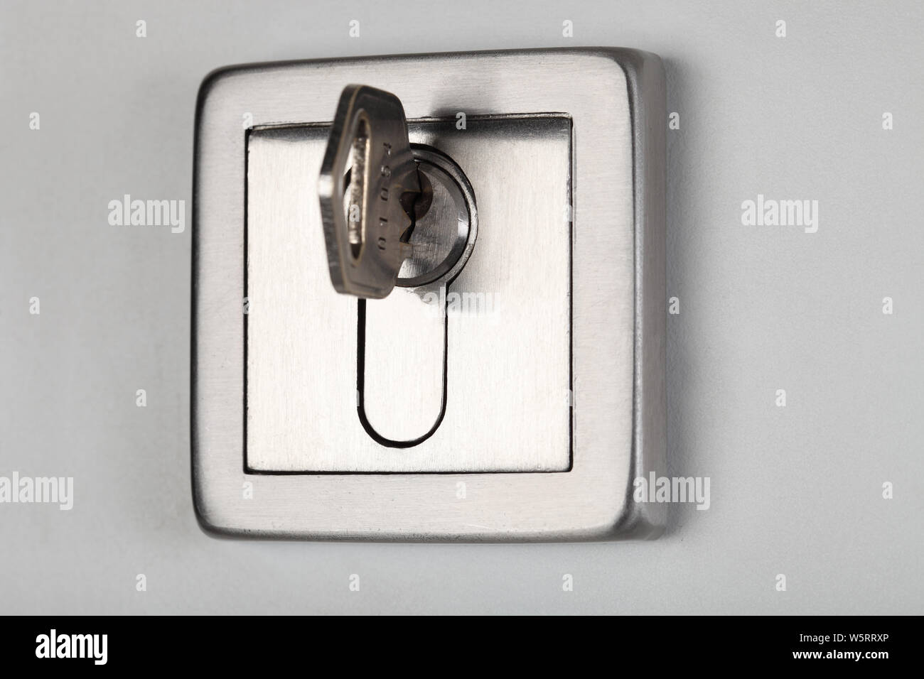 Key in keyhole Stock Photo - Alamy
