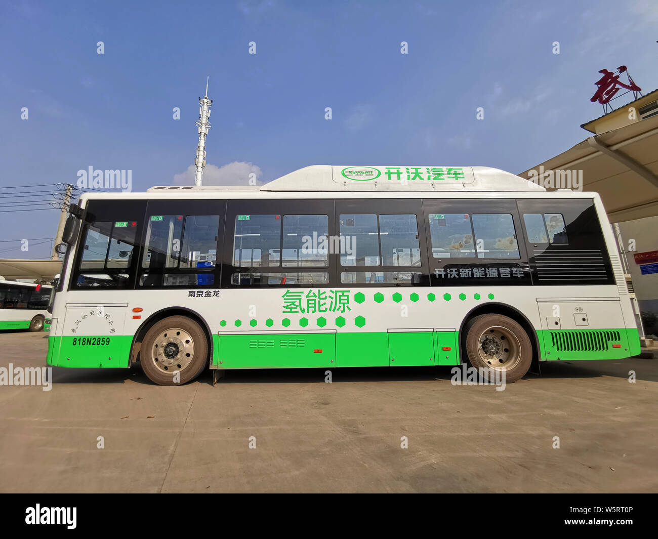 A hydrogen fuel-cell bus is parked at a local bus station in Wuhan city ...