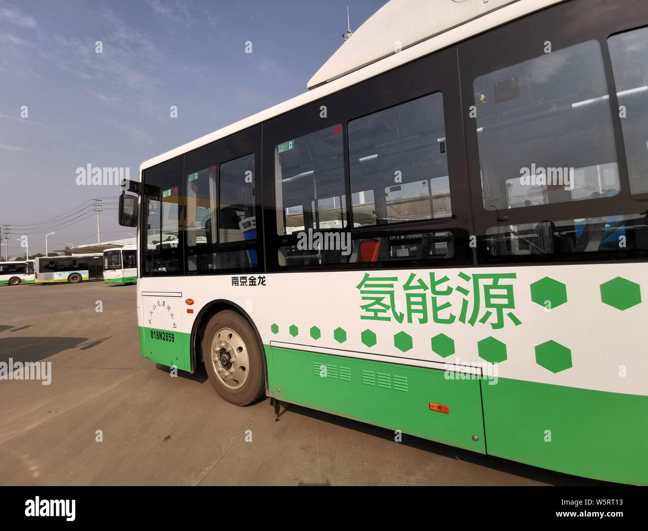 A hydrogen fuel-cell bus is parked at a local bus station in Wuhan city ...