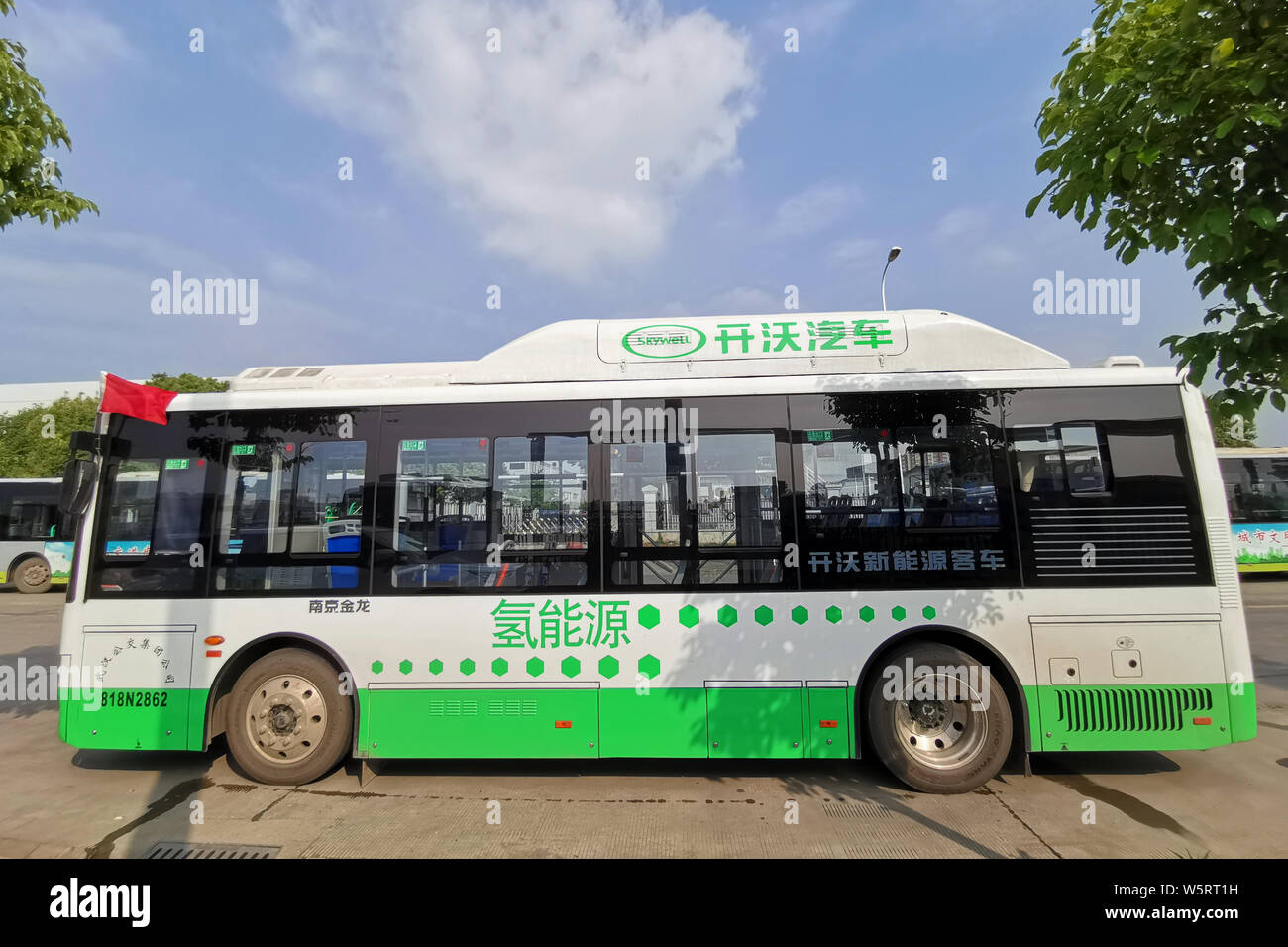 A hydrogen fuel-cell bus is parked at a local bus station in Wuhan city ...