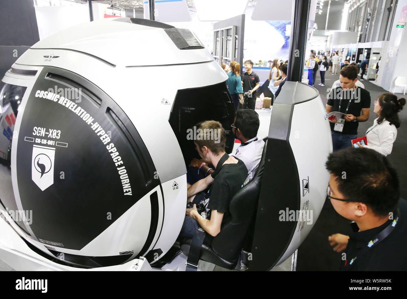 Visitors try out AR (Augmented Reality) technology at a capsule during ...