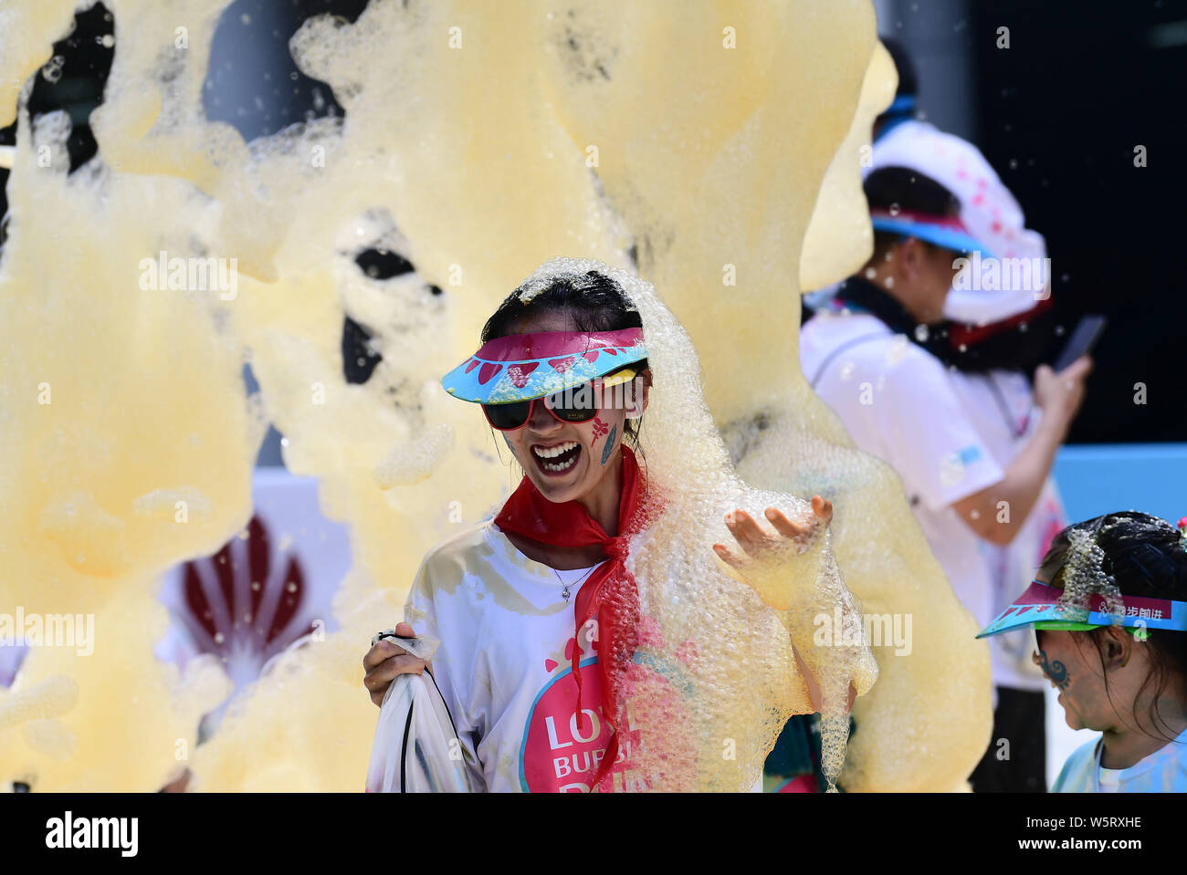 More than hundreds of parents and children enjoy a bubble run to mark the International Children ...