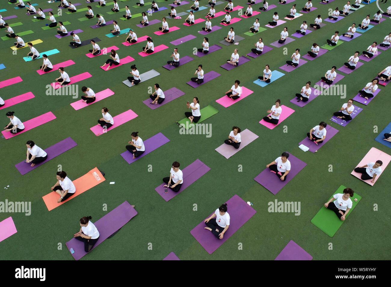 Thousands of Chinese yoga lovers practice yoga to mark the upcoming ...