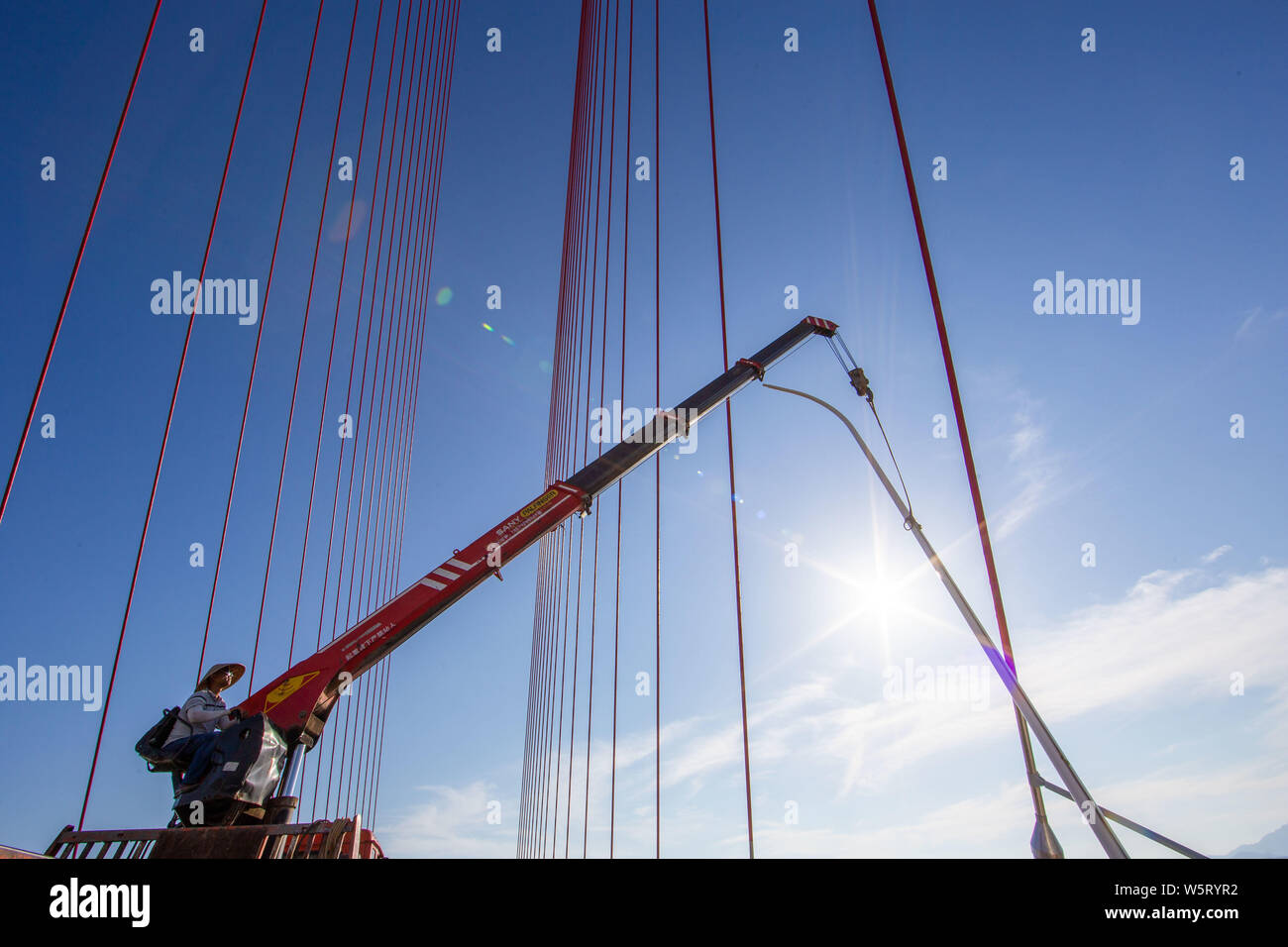 Chinese workers labor at the construction site of the Poyang Lake No. 2 ...