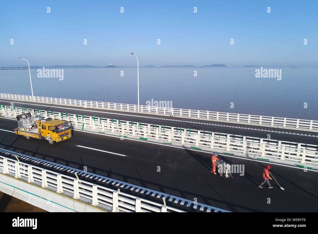 Chinese workers labor at the construction site of the Poyang Lake No. 2 ...