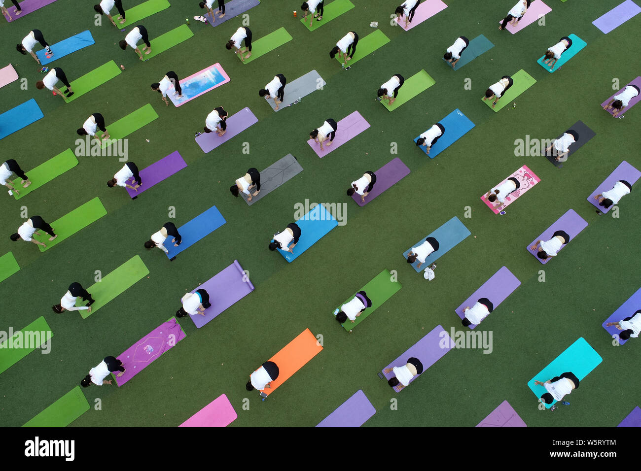 Thousands of Chinese yoga lovers practice yoga to mark the upcoming ...